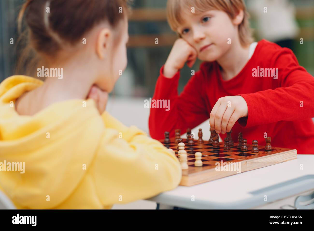 Little kids playing chess at kindergarten or elementary school Stock ...