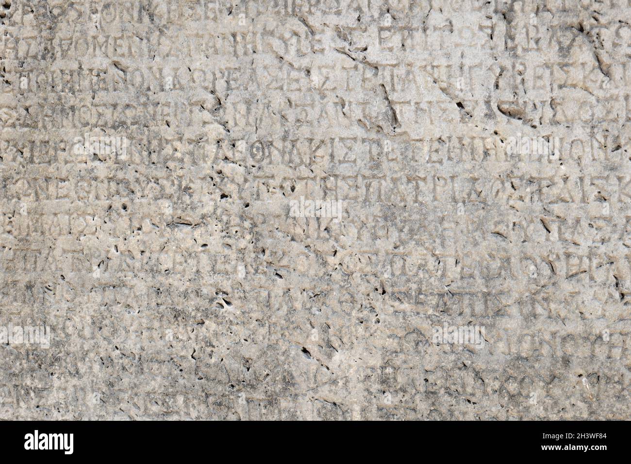 Ancient Greek inscriptions on stone in archeological ruin in ancient ...