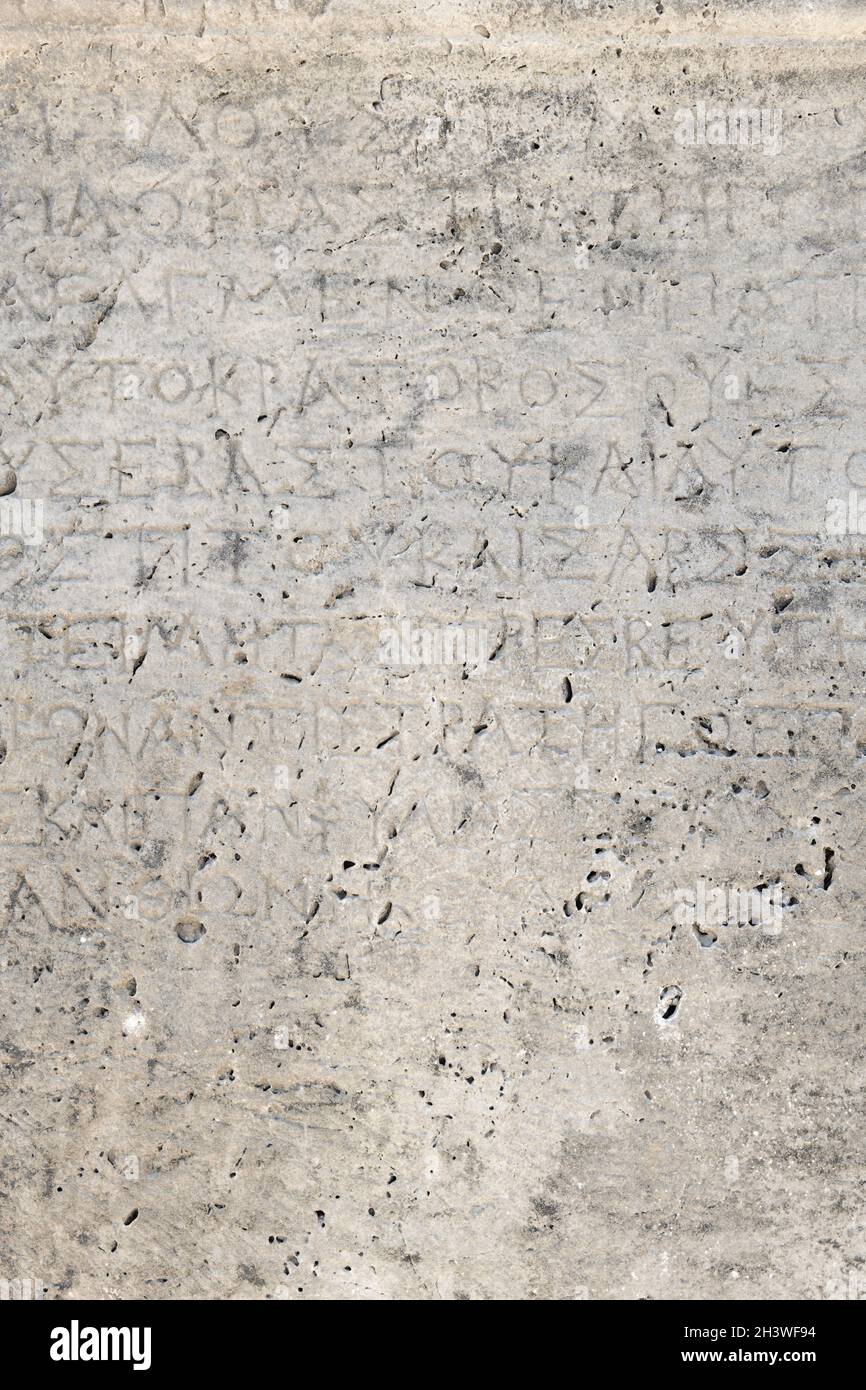 Ancient Greek inscriptions on stone in archeological ruin in ancient ...