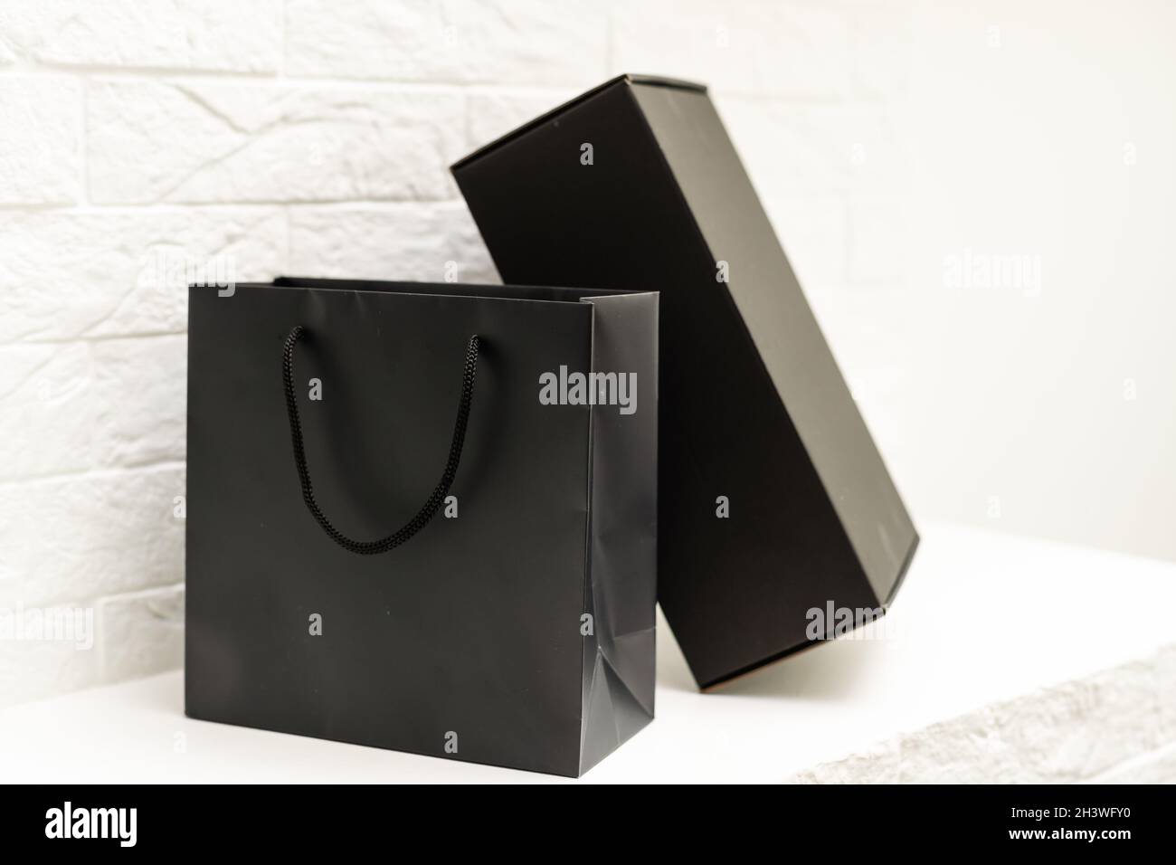 Black cardboard box over white background Stock Photo - Alamy