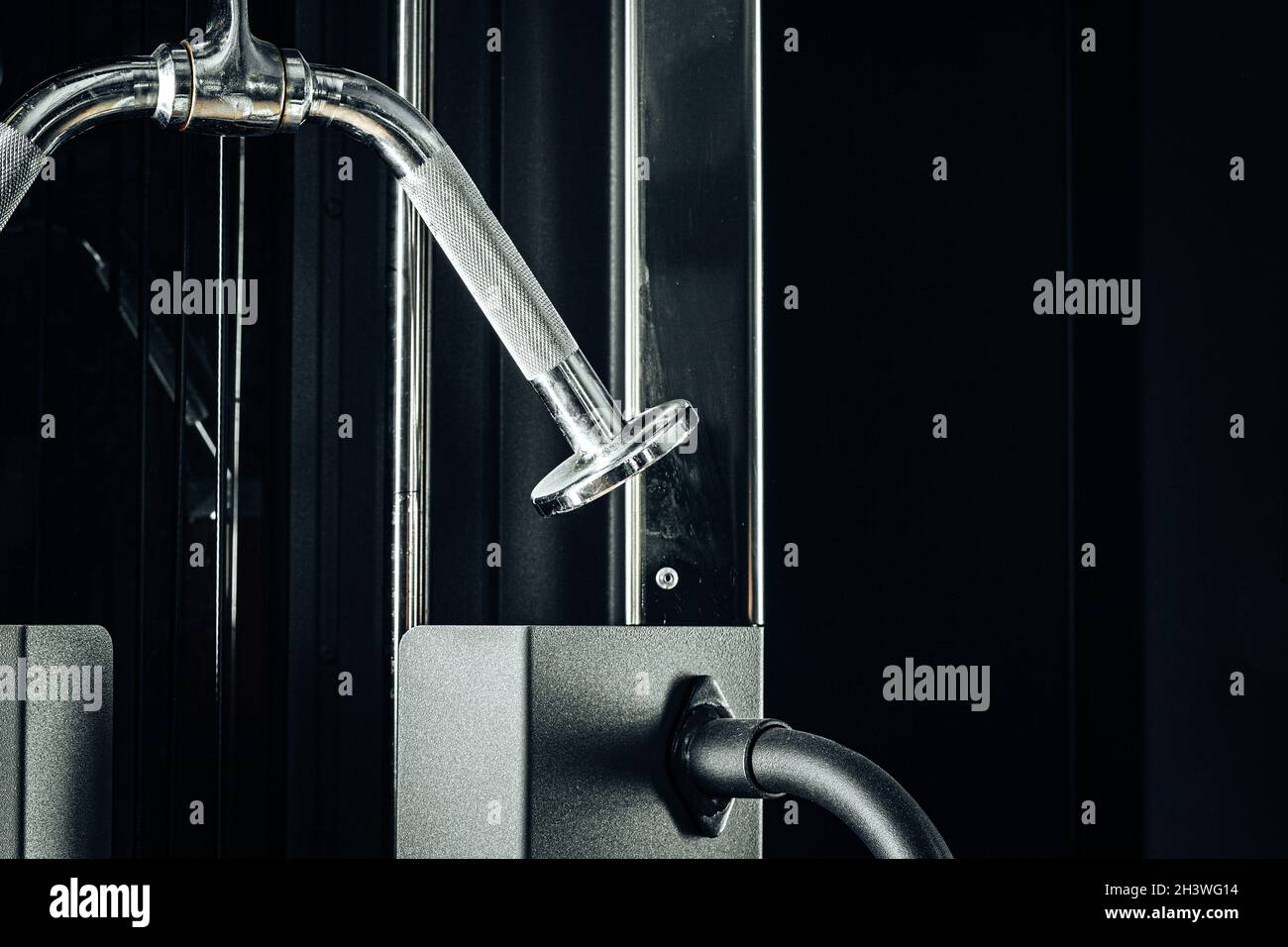 Metal pull rope handle in a gym close up Stock Photo - Alamy
