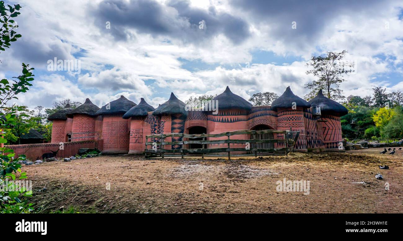 An image that captures an African settlement with modest, colorful and ...