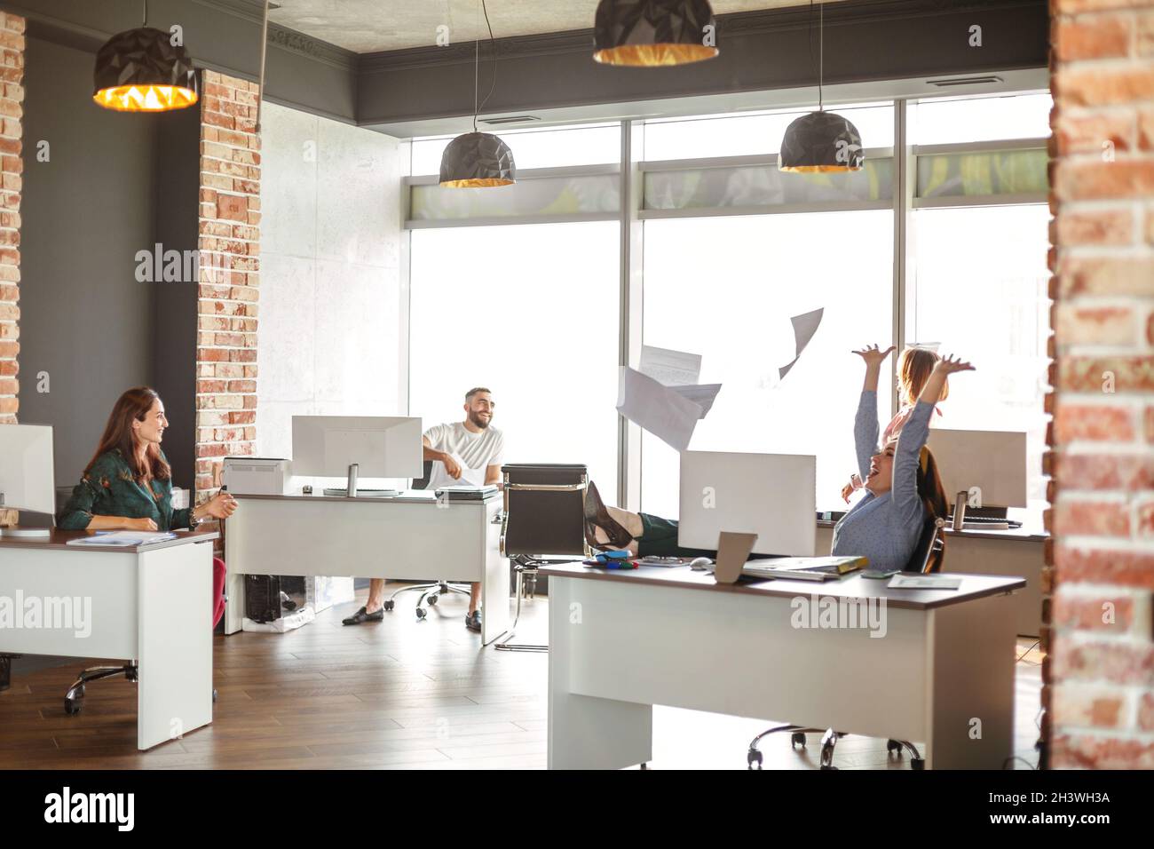 Office workers celebrating project finish Stock Photo - Alamy