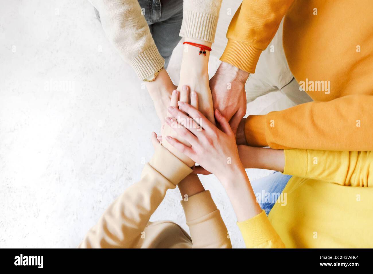 Diverse Teenagers. Teenagers putting their hands together Stock Photo ...