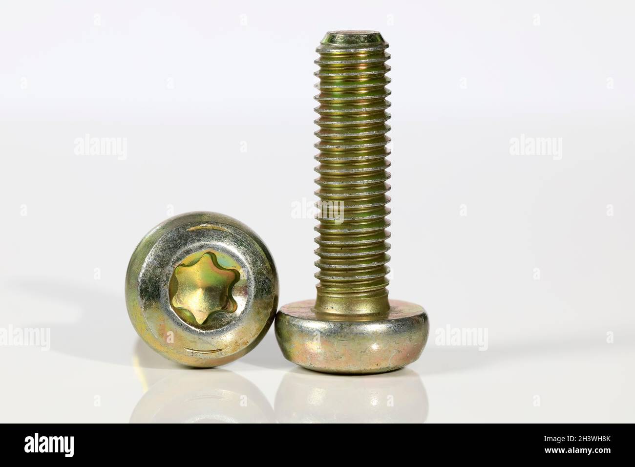 Two special purpose bolts of the same shape are shown from different ...