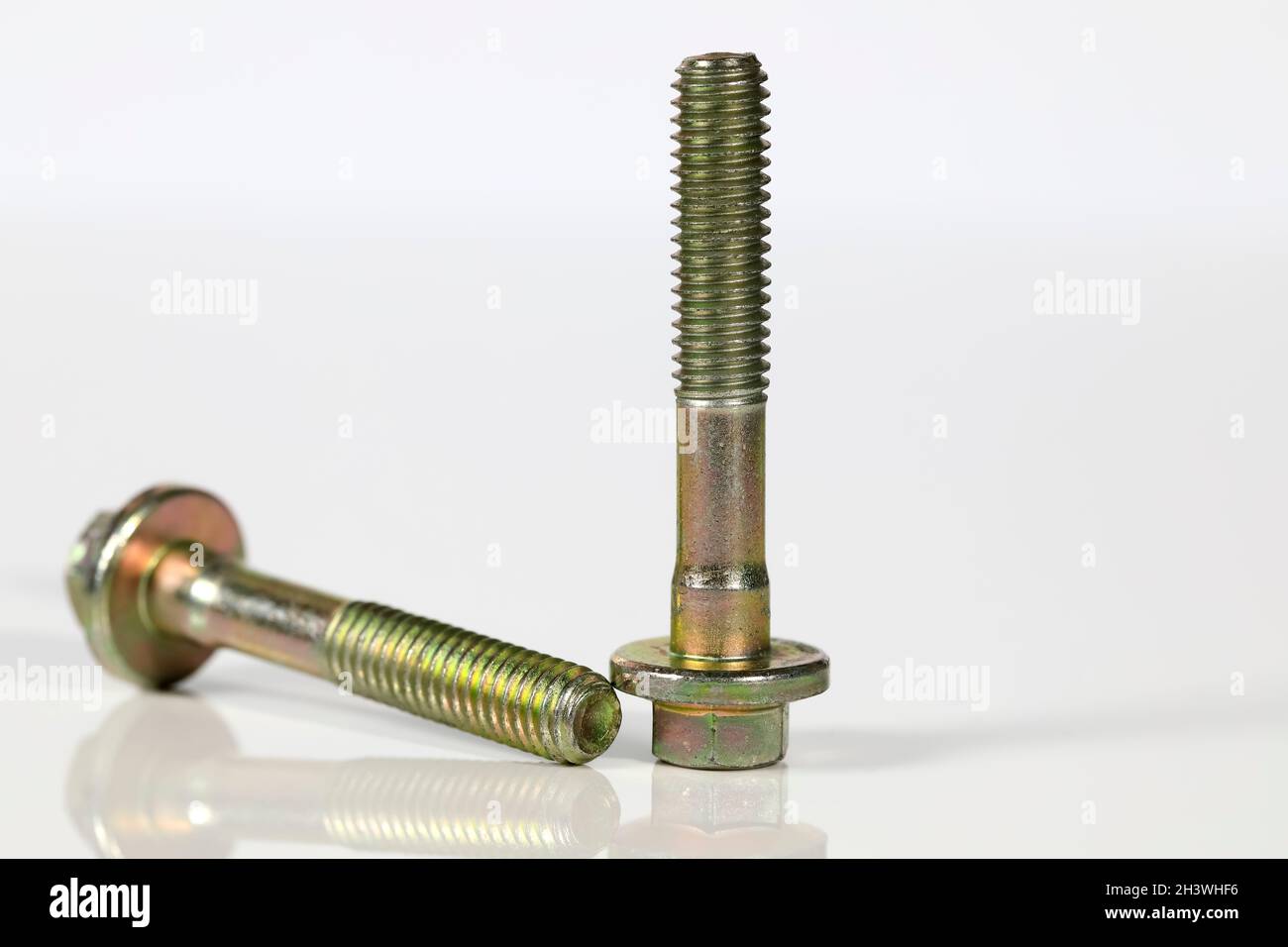 Two bolts of the same shape and purpose of use Stock Photo - Alamy