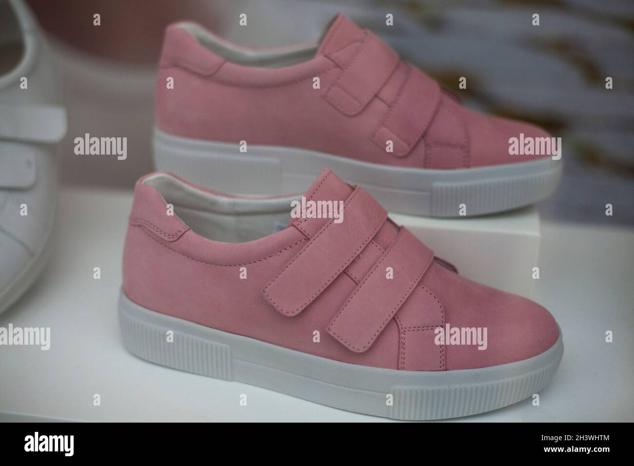 Women's shoes on display. Lightweight shoes without logos. Sale of ...