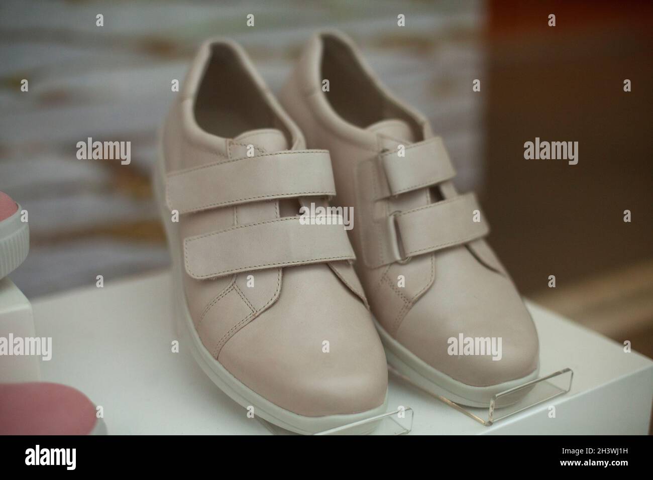 Women's shoes on display. Lightweight shoes without logos. Sale of ...