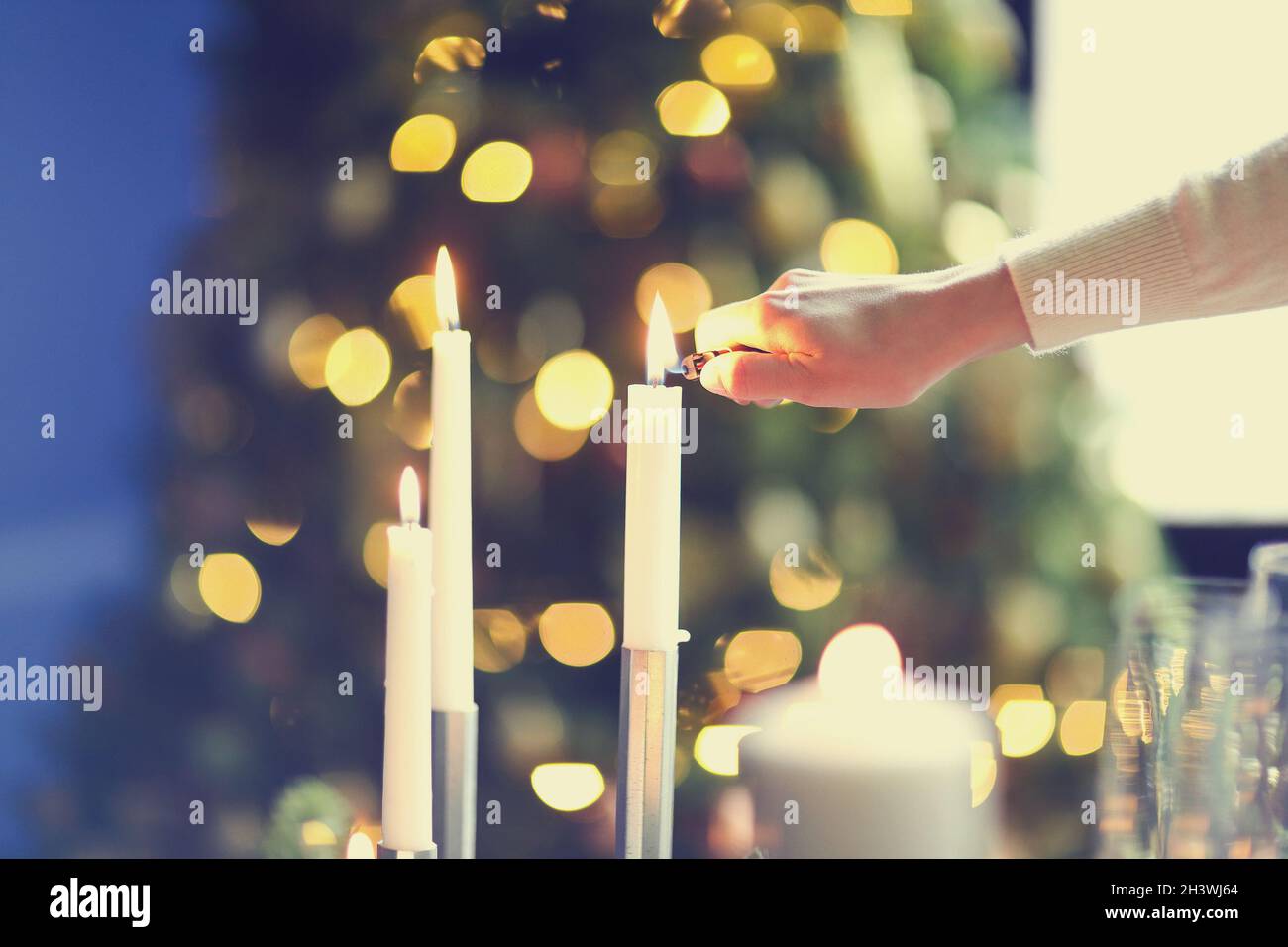 Crop woman burning candle anonymous hi-res stock photography and images ...