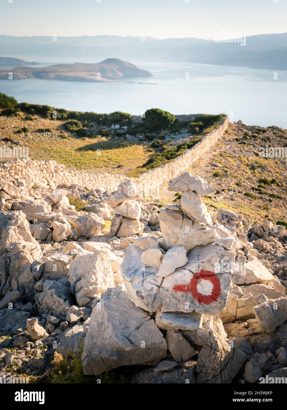 Dra stone wall and hiking trail on Mountain Kamenjak on island Rab ...