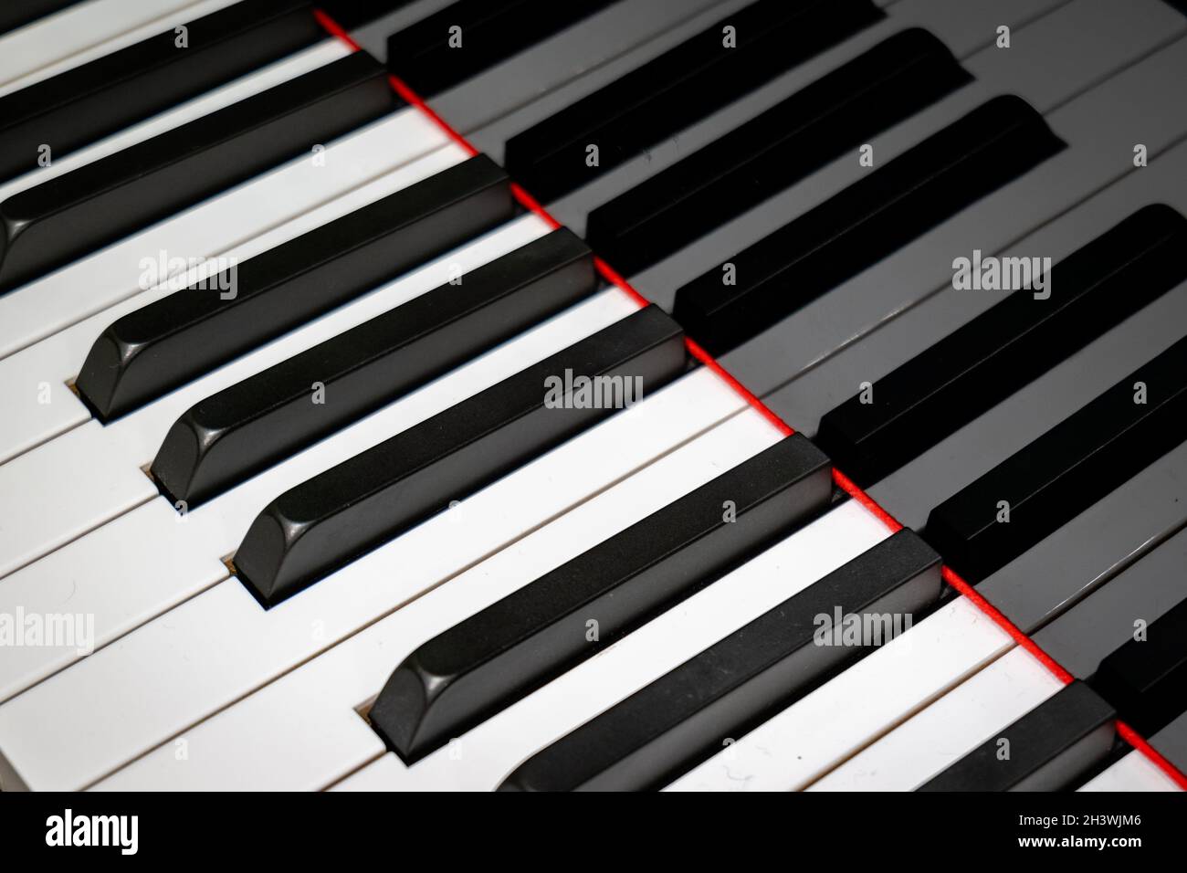 Piano keys on black classical grand piano - closeup for music ...