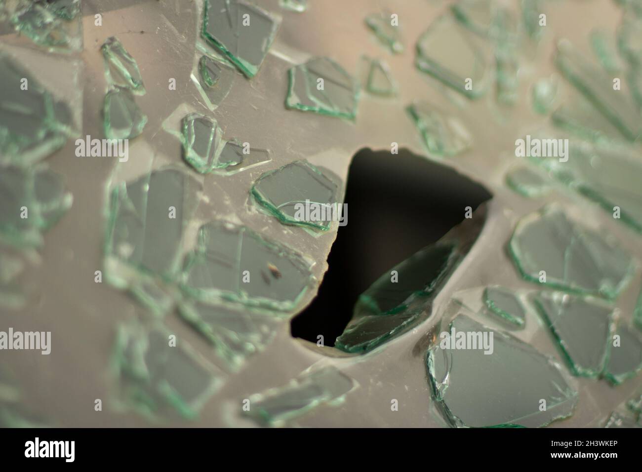 Broken glass in detail. Car windshield after the accident. Lots of ...