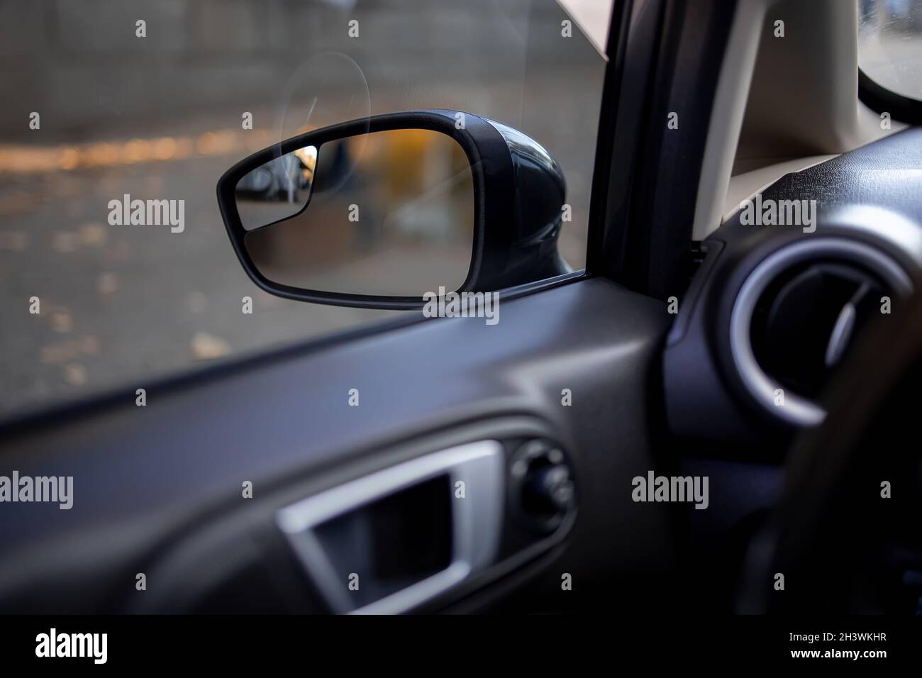 view from the interior of the car to the side mirror of the rear view ...