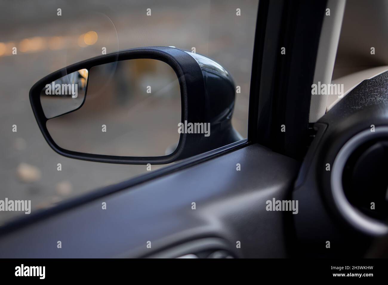 view from the interior of the car to the side mirror of the rear view ...