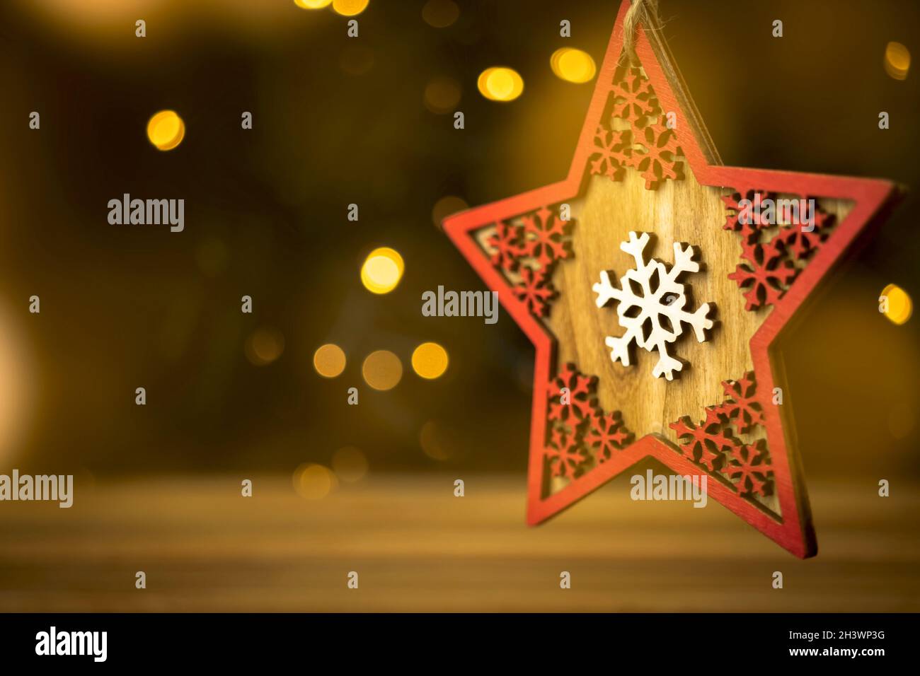Christmas decoration background. Wooden star closeup, blurred christmas lights and bokeh Stock ...
