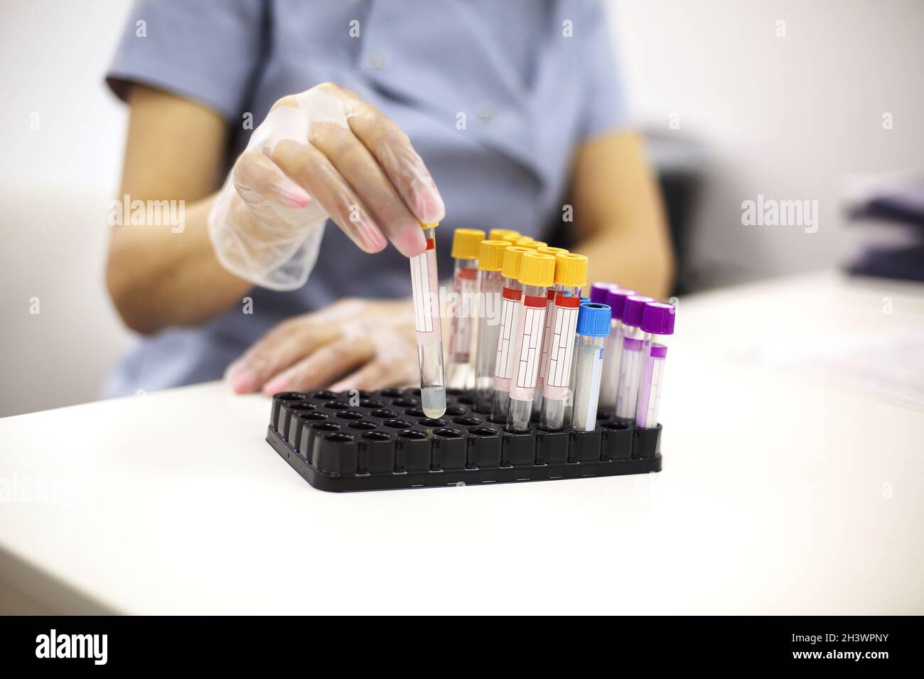 Woman doctor working test tubes hi-res stock photography and images - Alamy