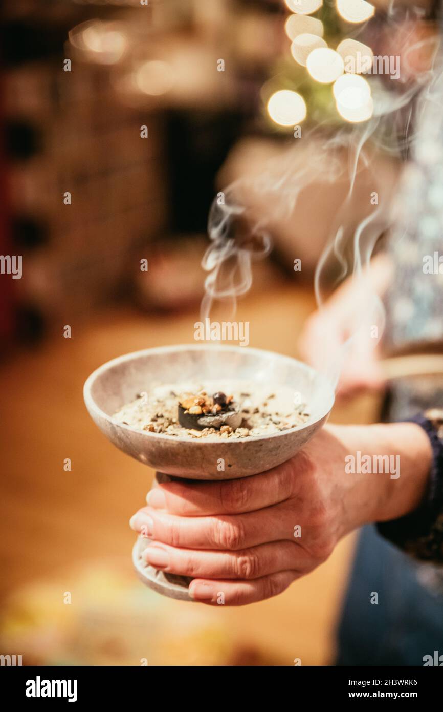 Traditional (esoteric) incense ritual at New Year and Christmas, smoke ...