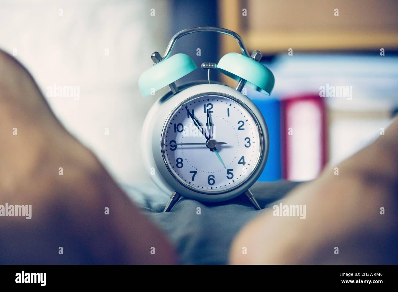 Alarm clock in the morning, legs Stock Photo - Alamy