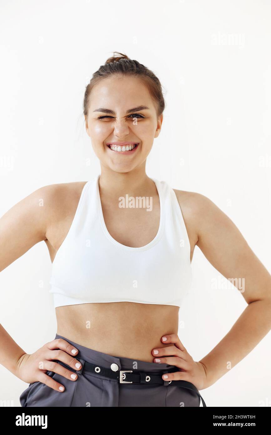 Beautiful woman pulling crop top Stock Photo - Alamy