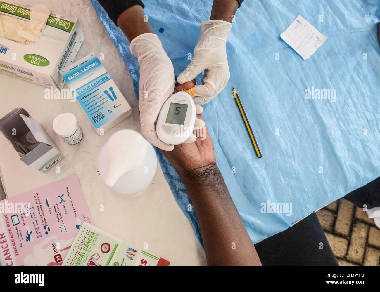 Nairobi, Kenya. 30th Oct, 2021. A nurse taking a blood test of a ...