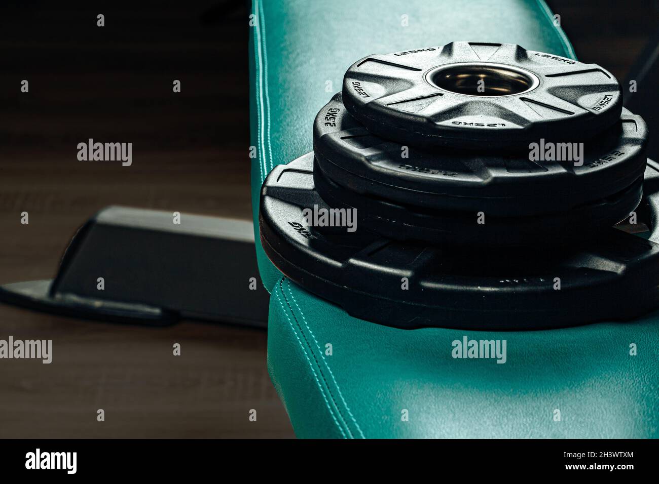 Weight plates in a gym, powerlifting equipment Stock Photo - Alamy