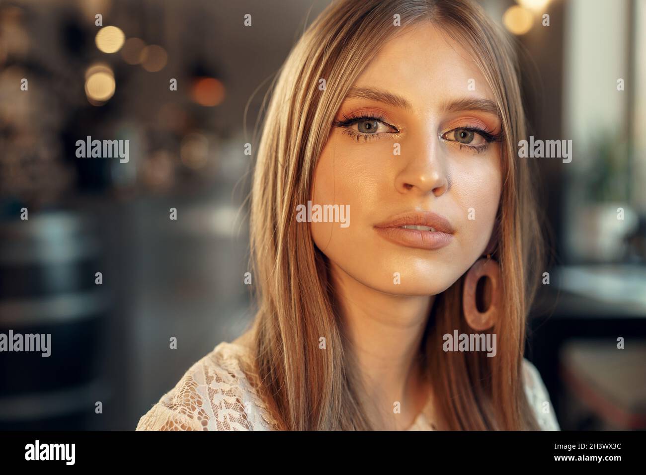 Beautiful female model portrait in a cafe Stock Photo - Alamy