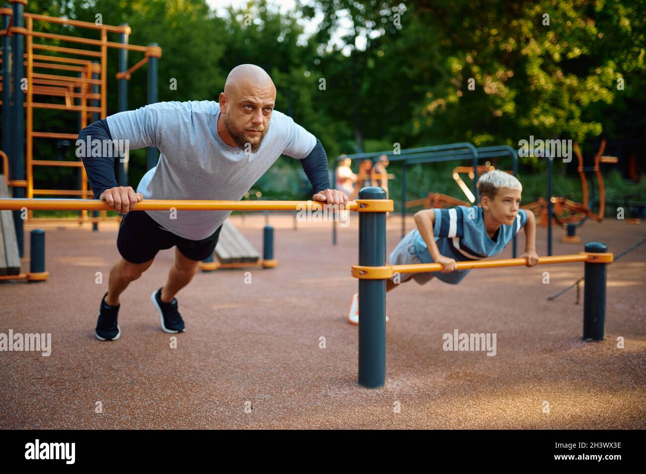 Father and child doing exercise, sport training Stock Photo - Alamy