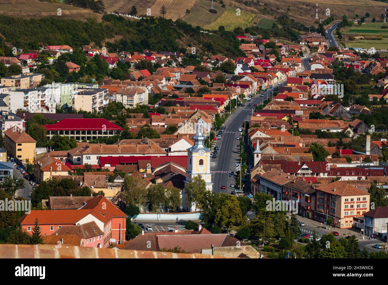 Aerial view of the town center with hills, buildings, streets ...