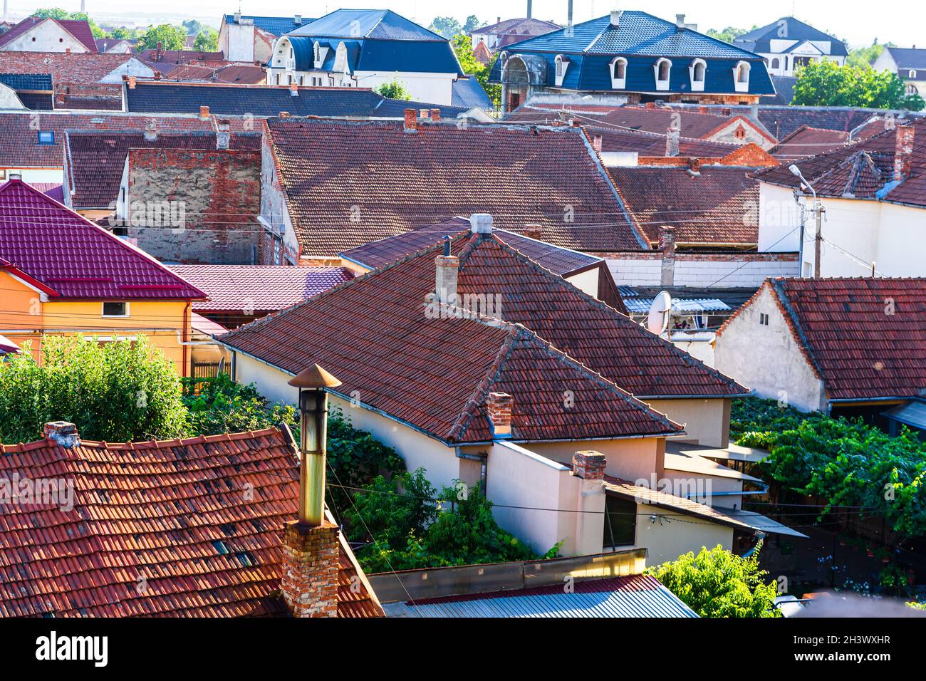 Overview of tile rooftops of old houses. Old buildings architecture ...