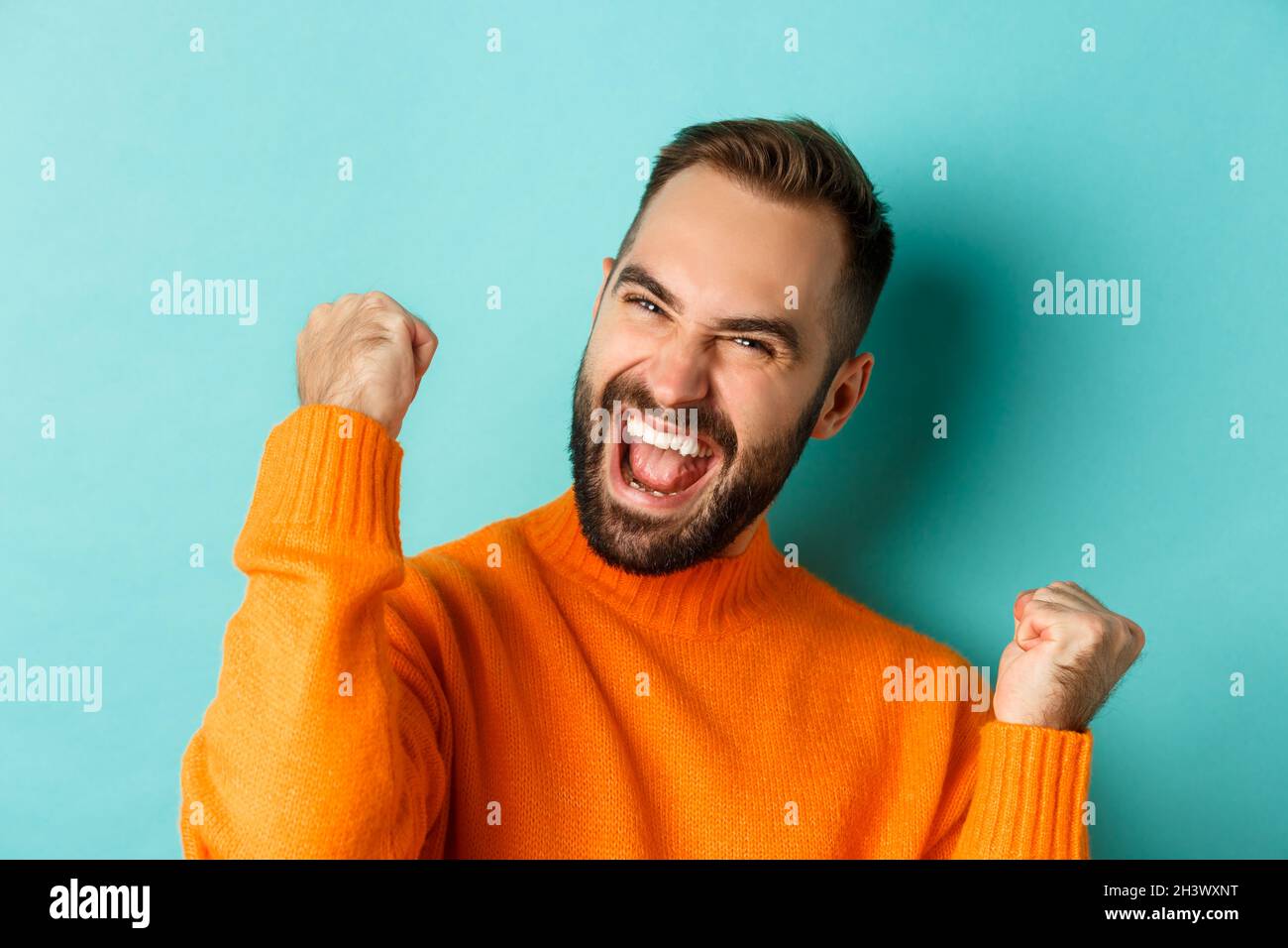 Image of handsome relieved man feeling satisfaction, rejoicing of ...
