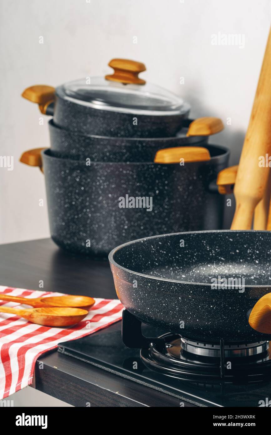 Frying pan on the gas stove in a kitchen Stock Photo - Alamy