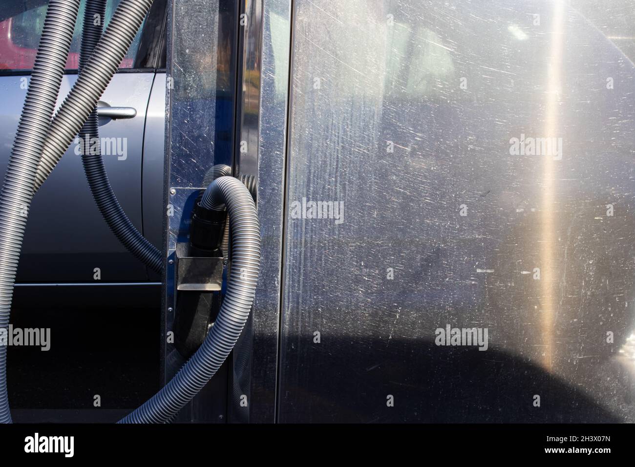 Vacuum cleaner in a compartment at a car wash close up Stock Photo - Alamy