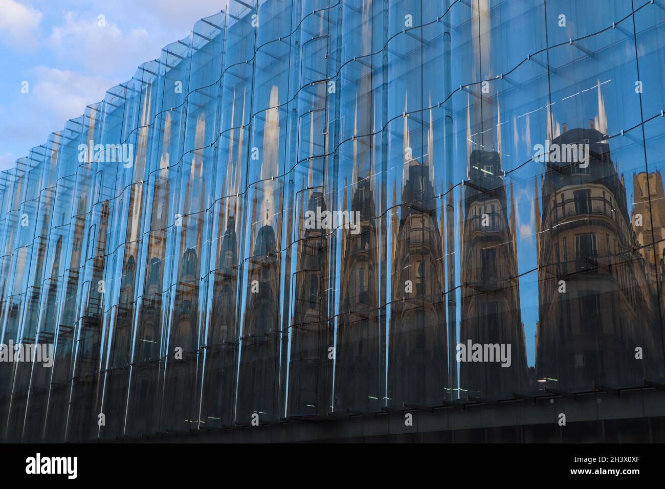 Amazing reflection of a traditional classic building in a modern glass ...