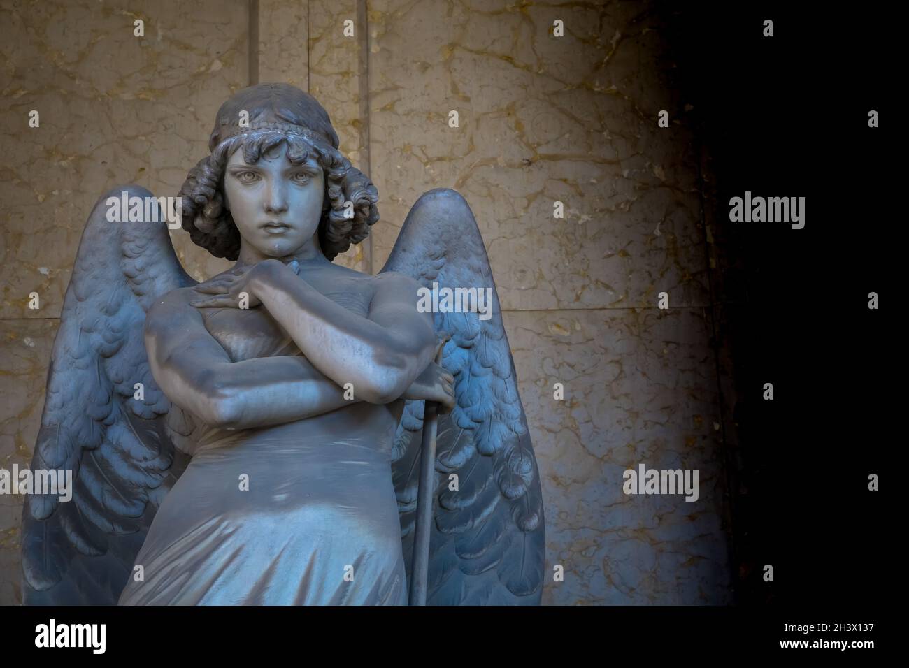 Statue of angel on an old tomb located in Genoa cemetery - Italy Stock ...