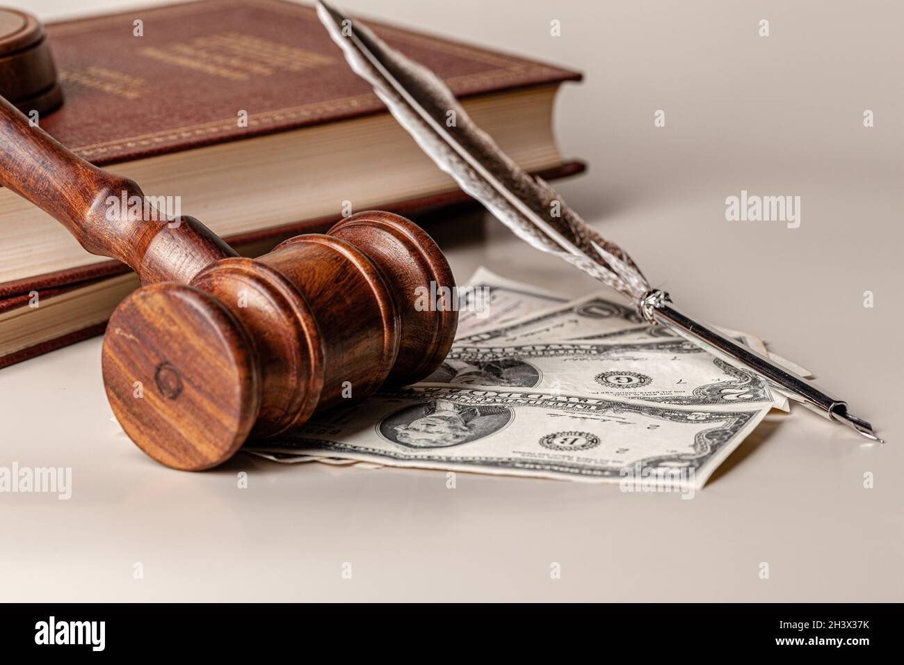 Law mallet and a stack of money Stock Photo - Alamy