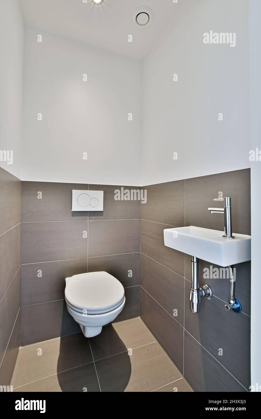 Interior of small clean restroom in miniature style Stock Photo - Alamy