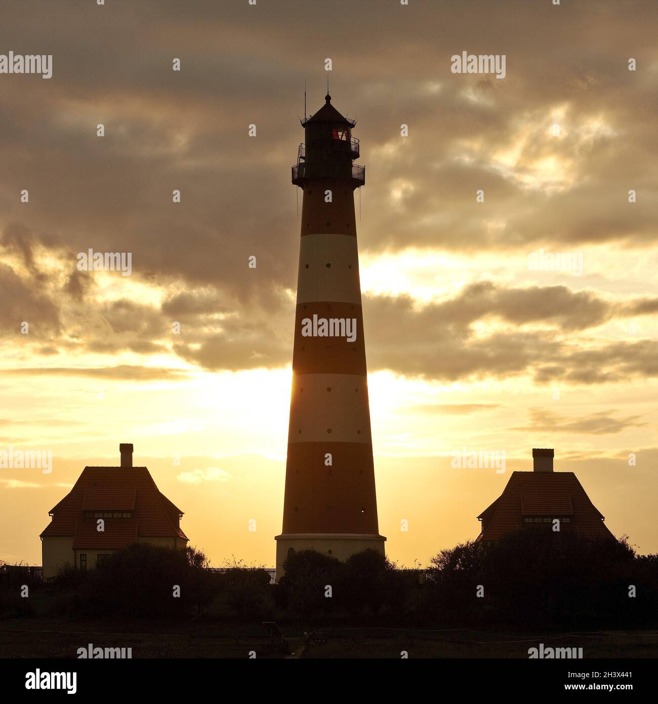 Westerhever lighthouse at sunset, Wadden Sea National Park, North Sea ...