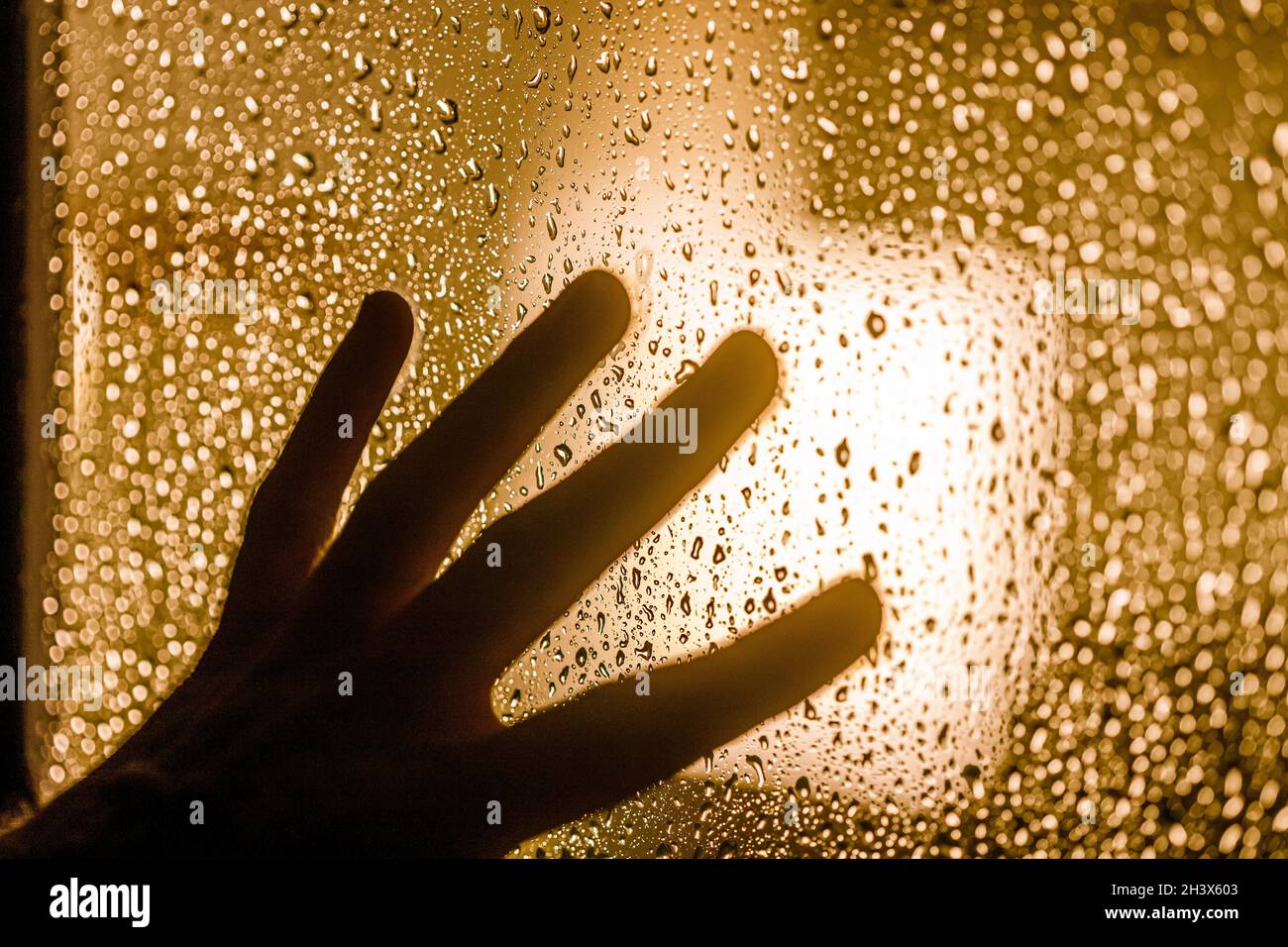 Depression and goodbye concept: dark silhouette of human hand on window ...