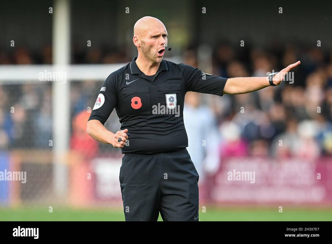 Referee Charles Breakspear gives the teams instructions during the game ...