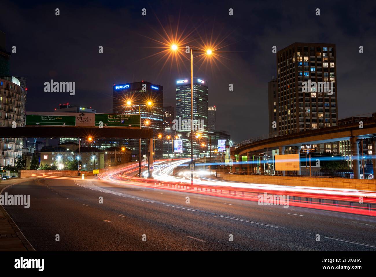 Traffic light trails on Aspen Way, Canary Wharf London England UK Stock ...