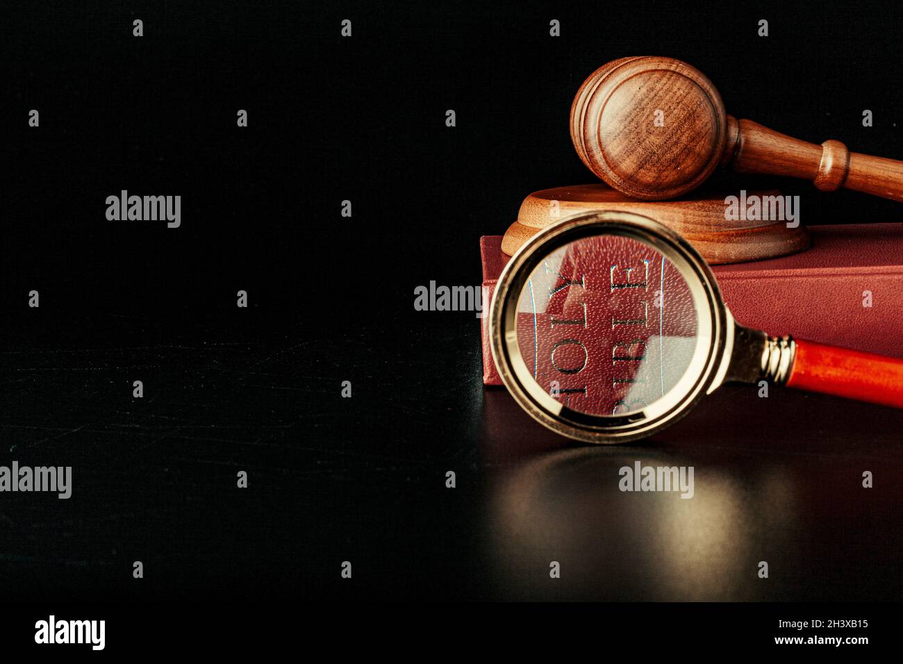 judge gavel with holy bible on black background Stock Photo - Alamy