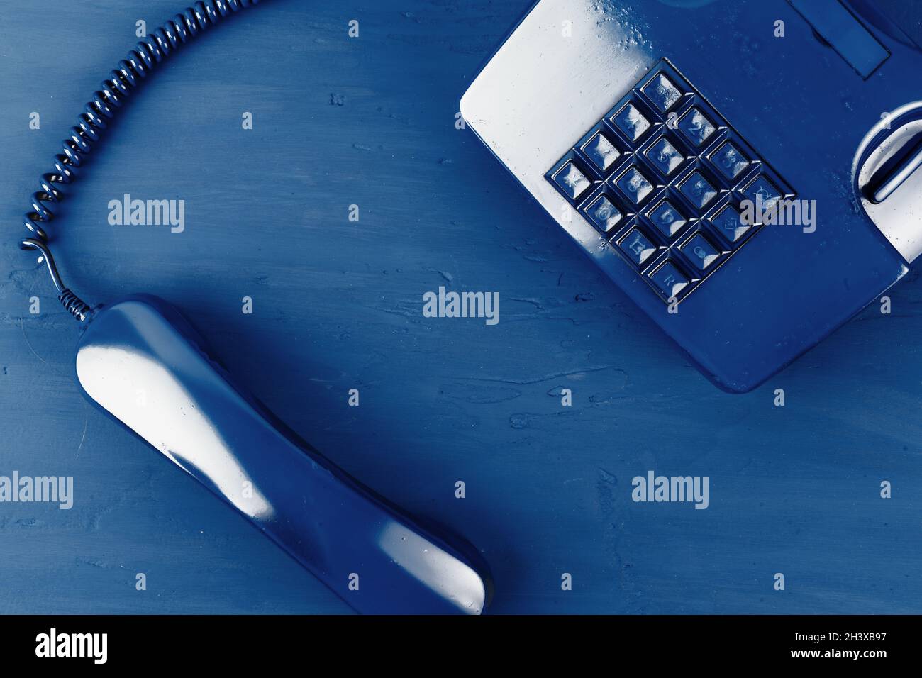 Retro telephone of blue color on classic blue background Stock Photo ...