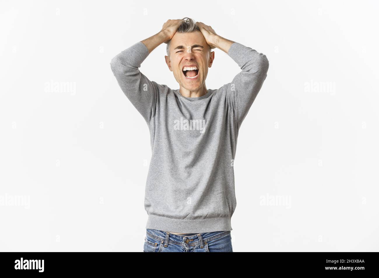 Image of frustrated middle-aged man panicking, losing something ...