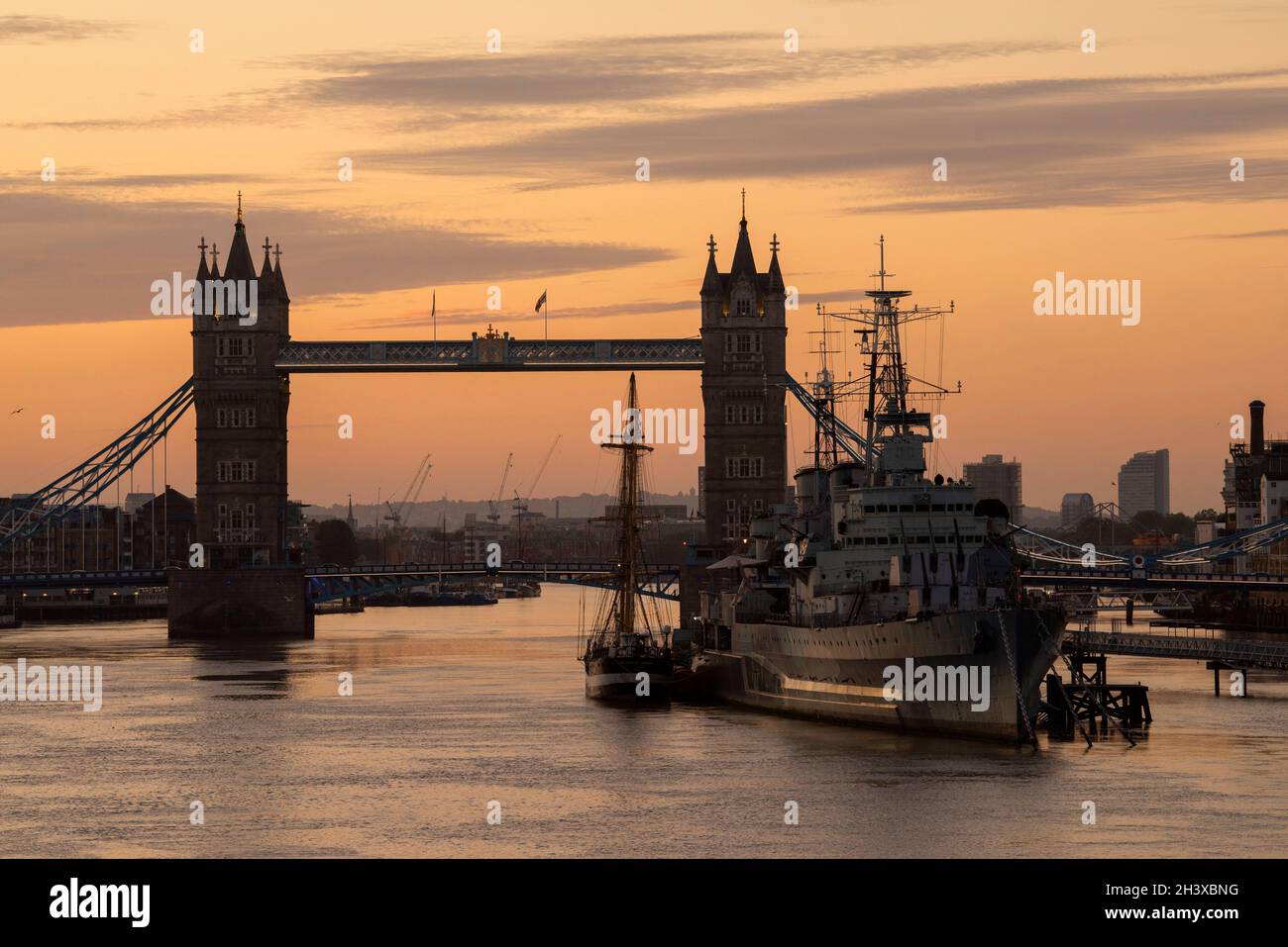 Sunrise looking towards Tower Bridge and HMS Belfast, London England UK Stock Photo - Alamy