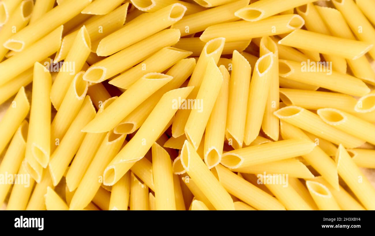 Penne Rigate Raw Pasta is a short pasta with oblique cuts and a ribbed ...