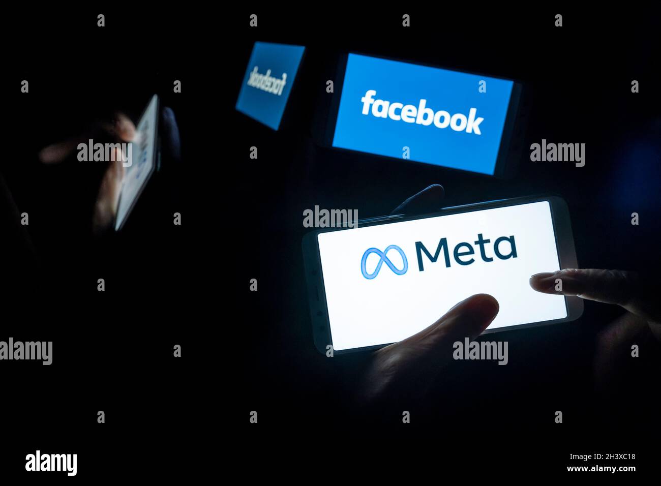 In this photo illustration, Meta and Facebook logos seen displayed on a ...