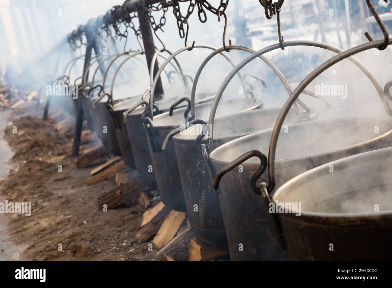 Preparation of food in boilers on an open fire in a traditional style ...