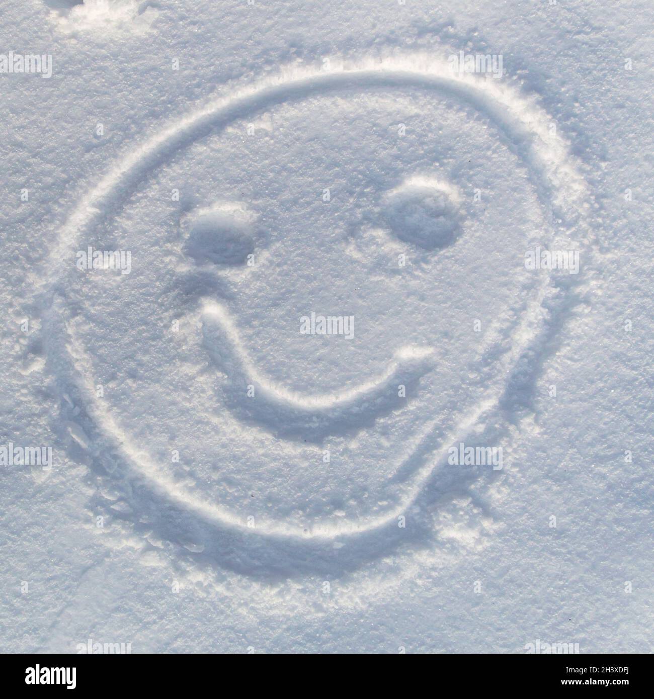 Smile drawn on fresh snow Stock Photo - Alamy