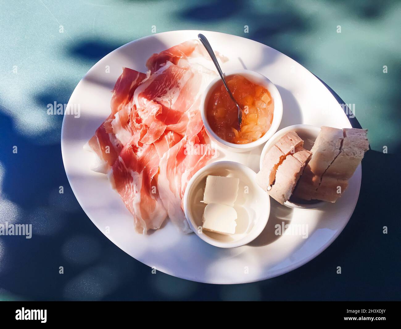Breakfast outdoors in summer, ham, jam, butter and ham Stock Photo - Alamy
