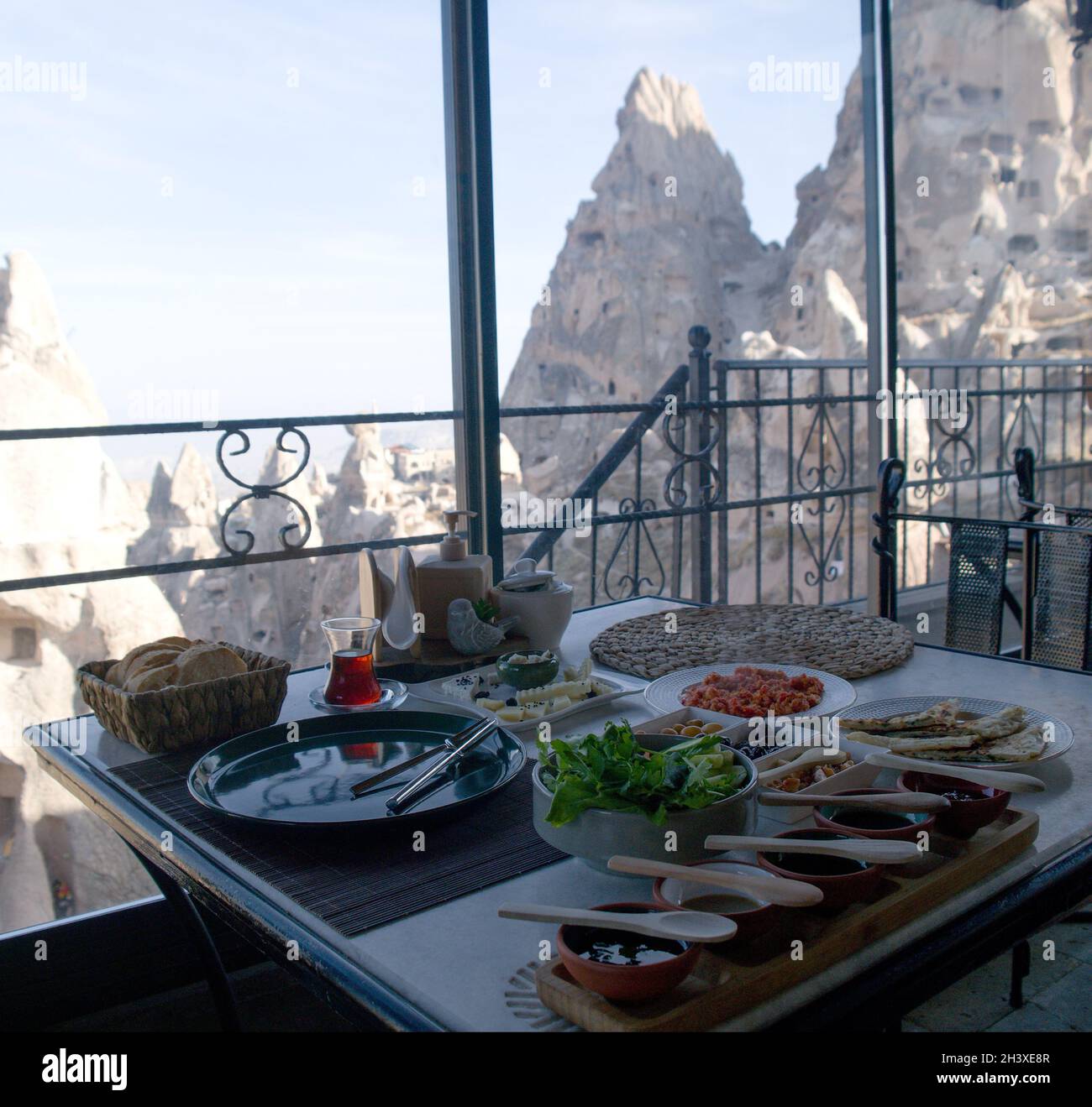 Breakfast with a view of Uchisar Castle in Cappadocia Stock Photo - Alamy